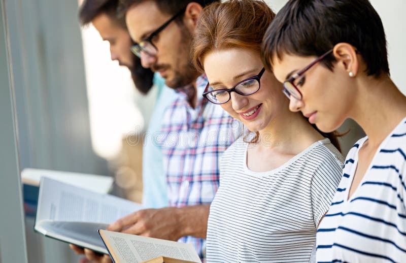 Happy Group of Students Studying and Working Together in a College ...