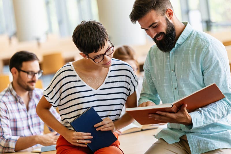 Happy Group of Students Studying and Working Together in a College ...