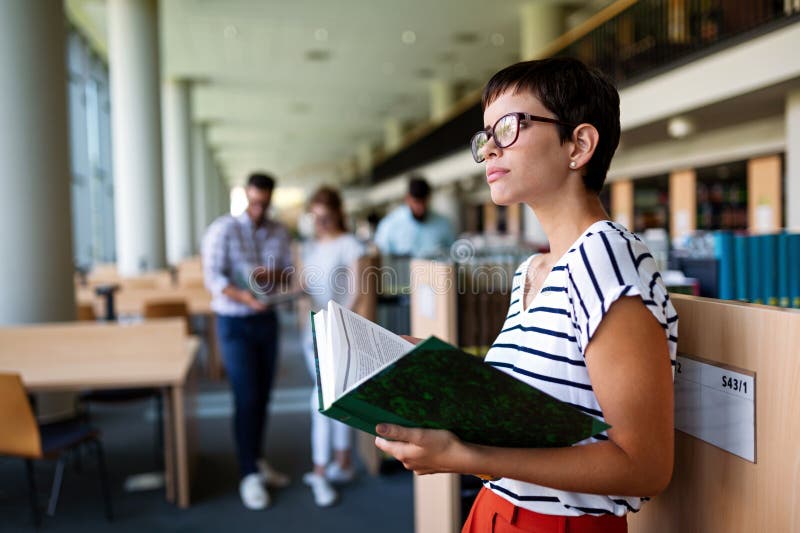 Happy Group of Students Studying and Working Together in a College ...