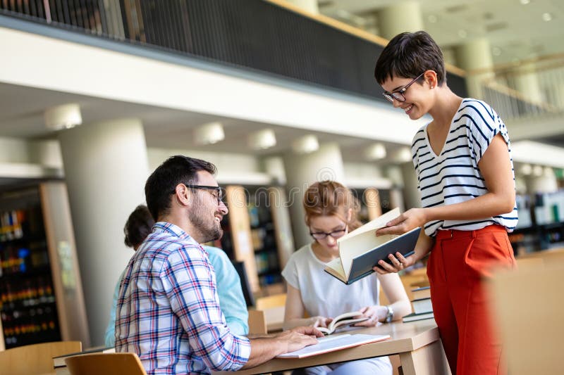 Happy Group of Students Studying and Working Together in a College ...