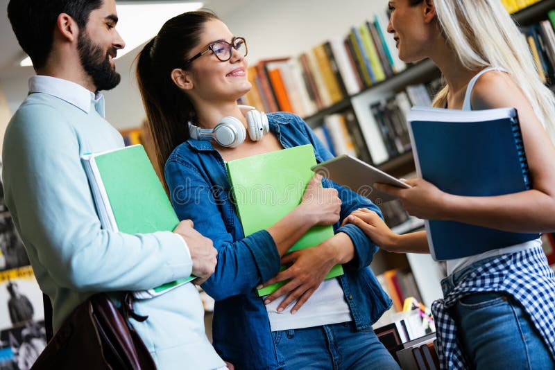Happy Group of Students Studying and Working Together in a College ...