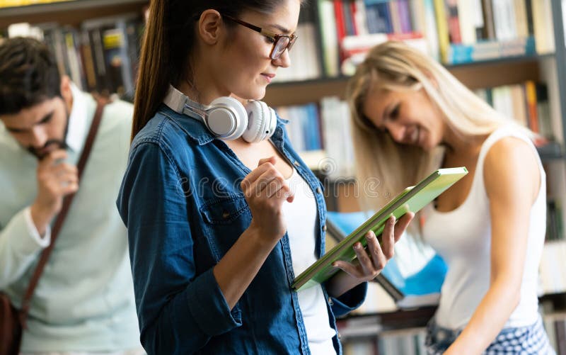 Happy Group of Students Studying and Working Together in a College ...