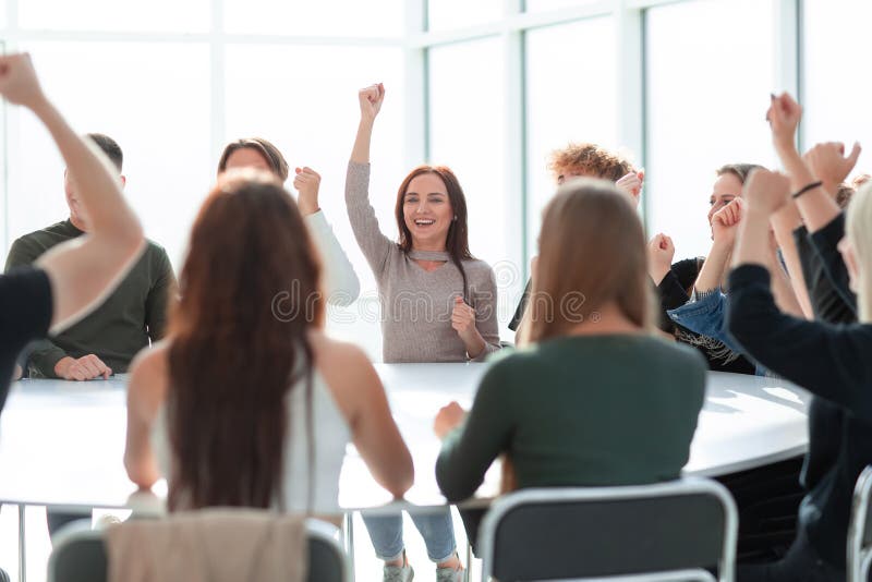Happy Group of Young People Sitting at a Round Table Stock Image ...