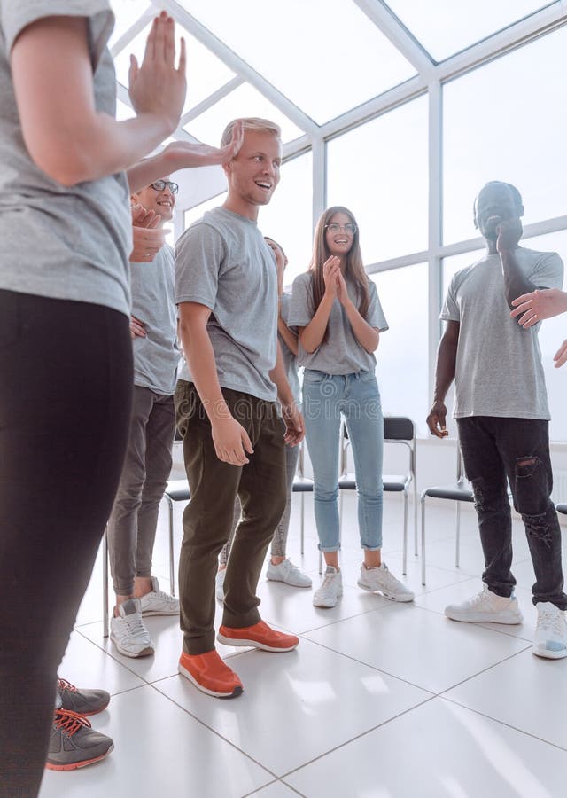 Happy Group of Young People Standing in the Conference Room Stock Photo ...