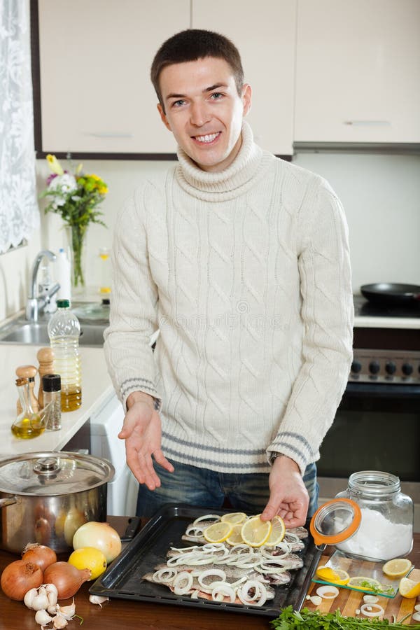 Happy Guy Cooking Trout Fish with Lemon Stock Photo - Image of trucha ...