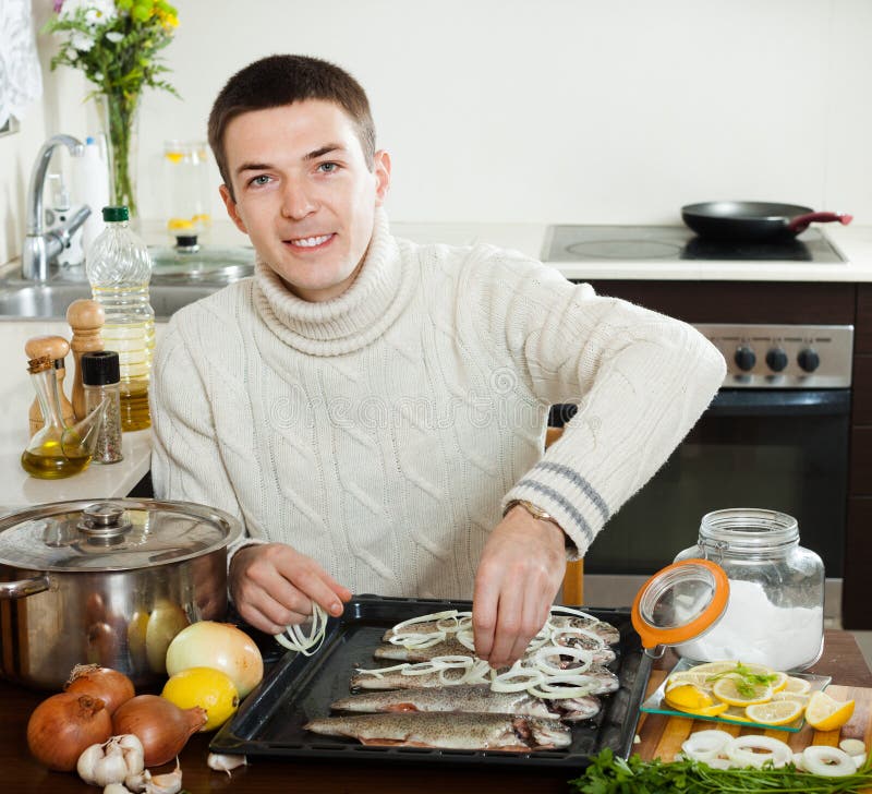 Happy Guy Cooking Trout Fish with Onion Stock Image - Image of ...