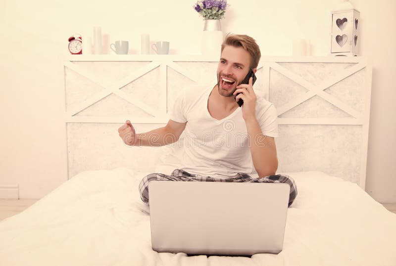 Happy Guy Make Winner Gesture Talking on Mobile Phone in Bed, Victory ...