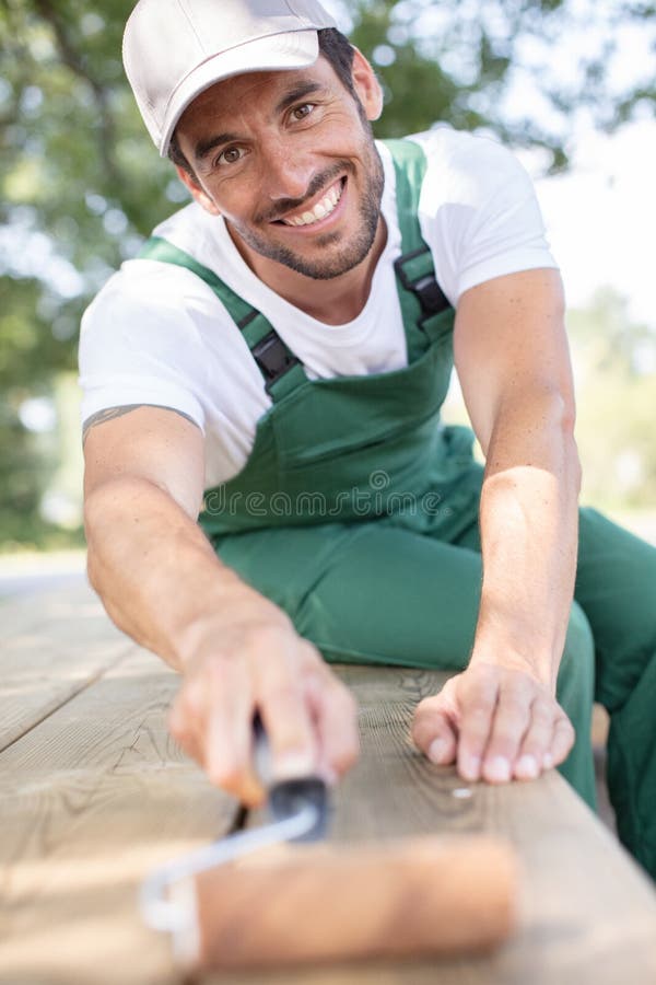 Happy Handsome Handyman Renovating Terrace Stock Photo - Image of brown ...