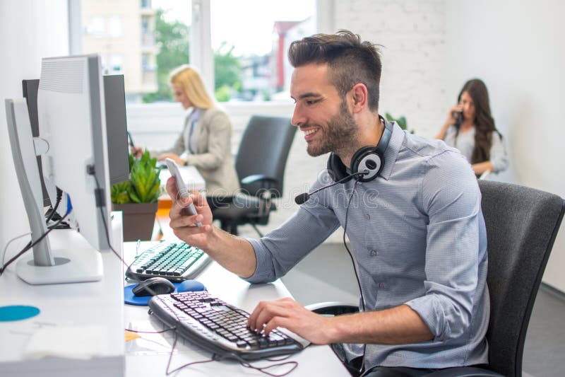 Happy Handsome Man Call Operator with Headset Using Phone at Office ...