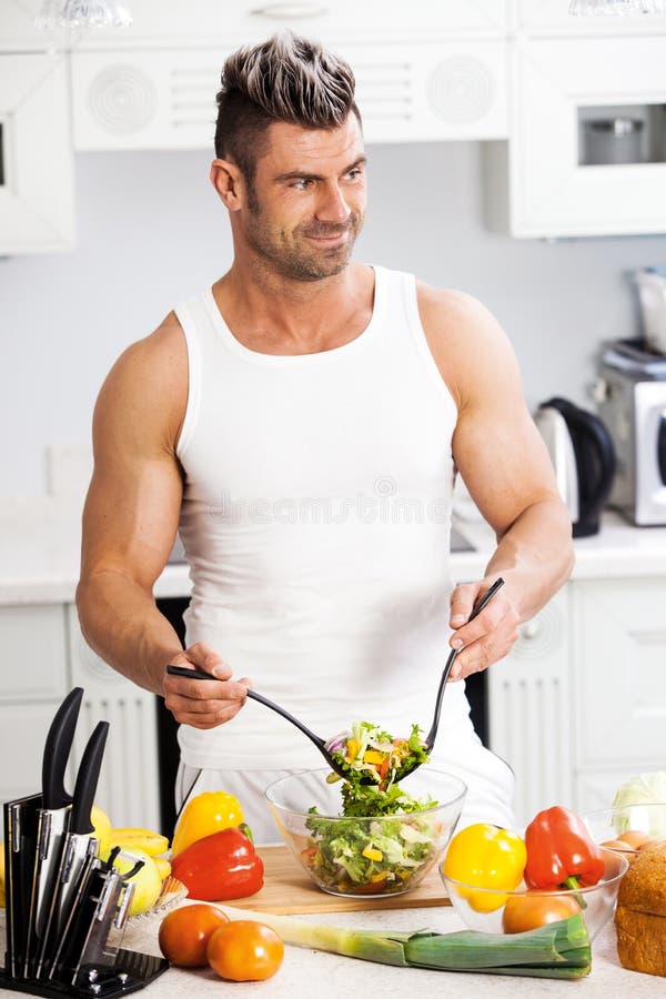 Happy Handsome Man Cooking in Kitchen at Home. Stock Photo - Image of ...