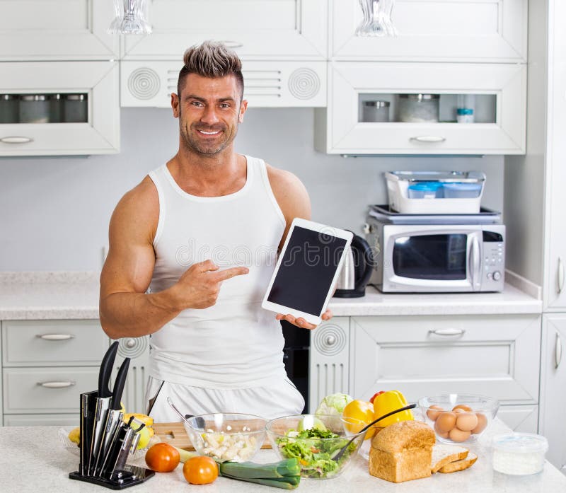 Happy Handsome Man Cooking in Kitchen at Home. Stock Photo - Image of ...