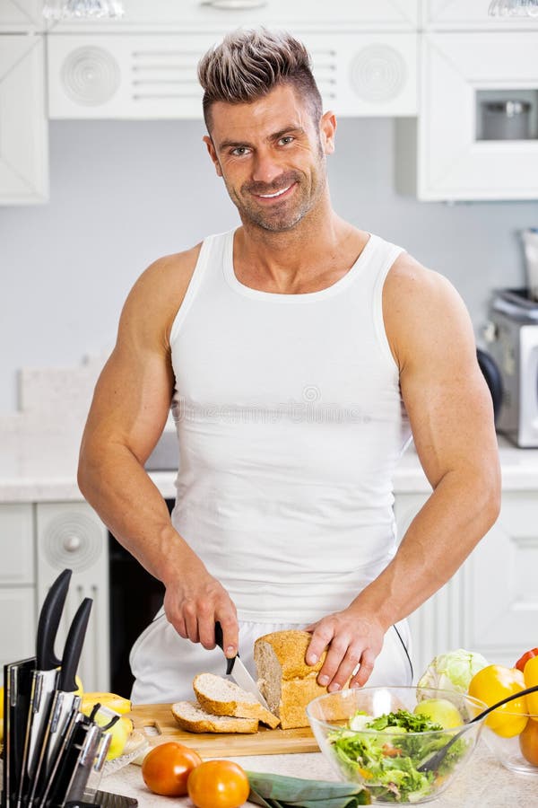 Happy Handsome Man Cooking in Kitchen at Home. Stock Image - Image of ...