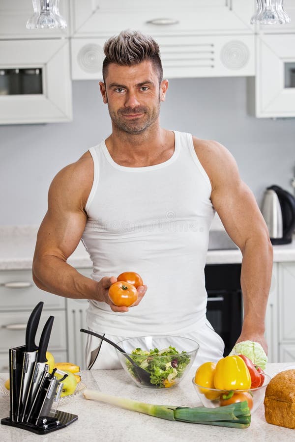 Happy Handsome Man Cooking in Kitchen at Home. Stock Image - Image of ...