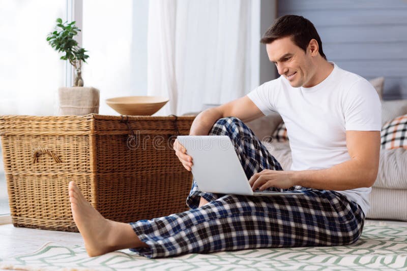Happy Handsome Man Looking at the Laptop Screen Stock Photo - Image of ...