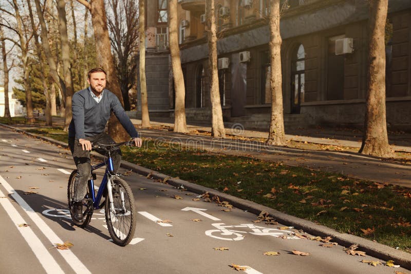 Happy Handsome Man Riding Bicycle on Lane in City Stock Image - Image ...