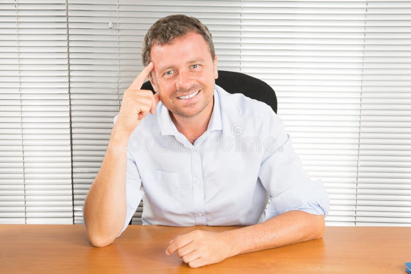 Handsome Man Smile Sit at Table in Office Building Stock Photo - Image ...