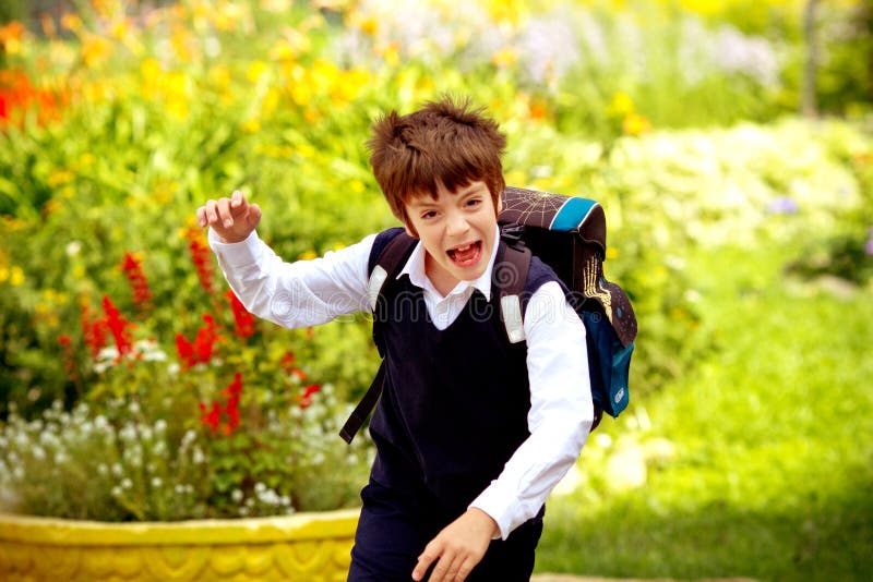 Happy Handsome School Boy Running and Screaming on the School Yard ...