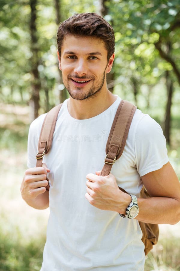 Happy Handsome Young Man with Backpack Standing Outdoors Stock Image ...