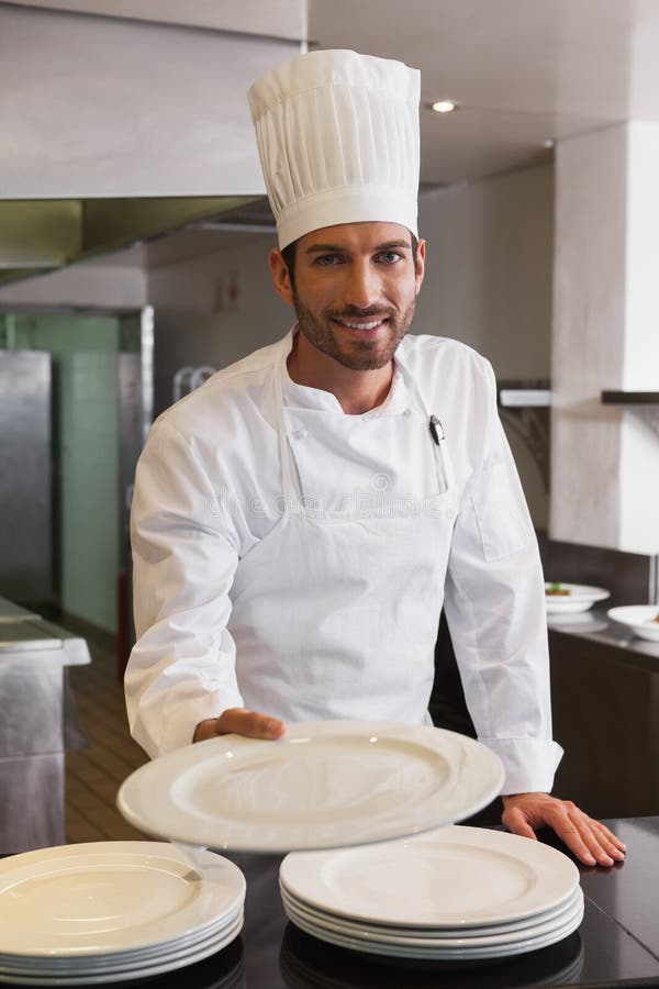 Happy Head Chef Offering a Plate Smiling at Camera Stock Image - Image ...