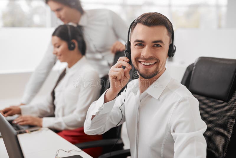 Happy Help Line Worker Looking at Camera Stock Photo - Image of ...