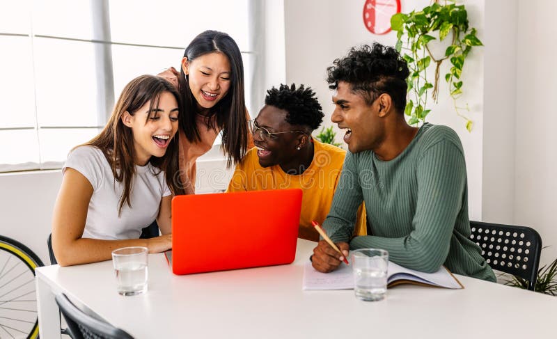 Happy High School Students Learning Together Using Laptop Computer at ...
