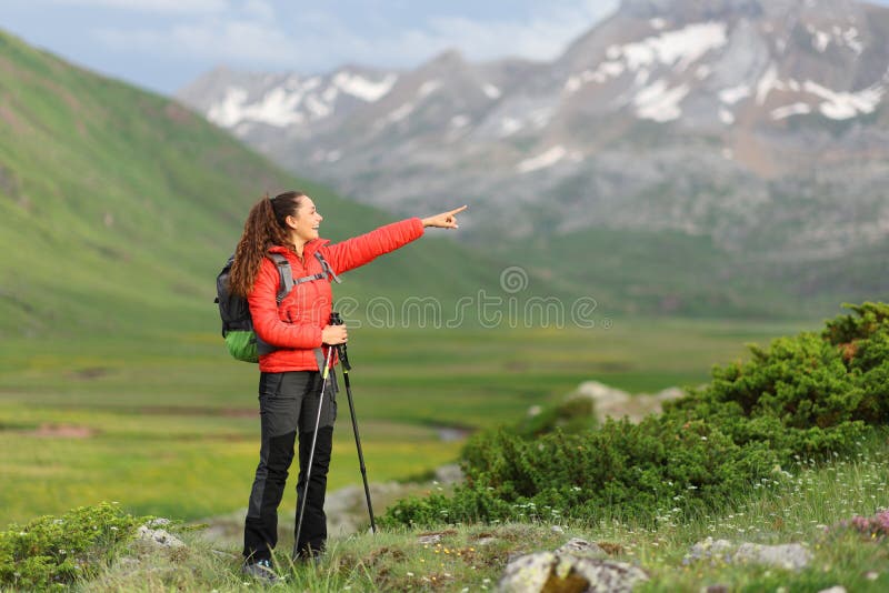 Happy Hiker Pointing Away in the Mountain Stock Photo - Image of ...