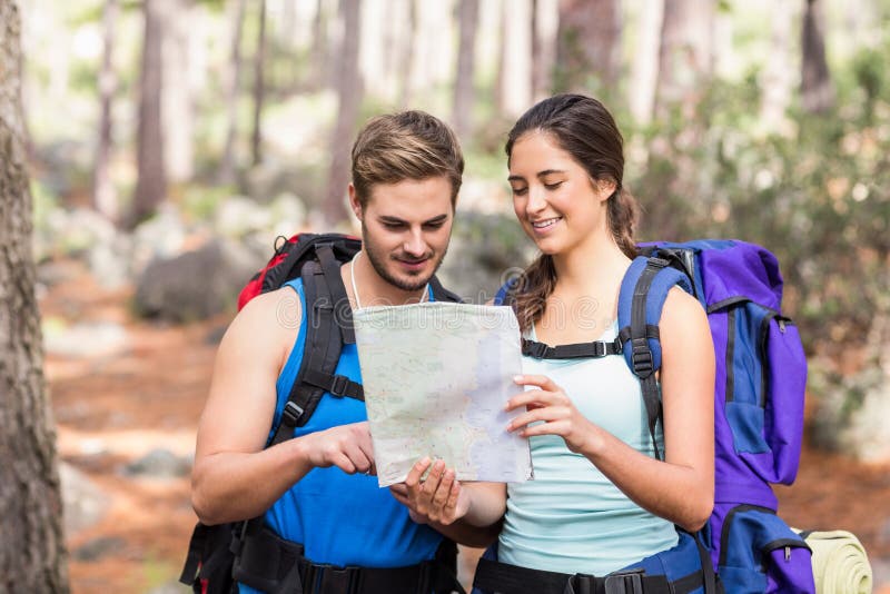 Happy Hikers Looking at Map Stock Photo - Image of exercising, female ...