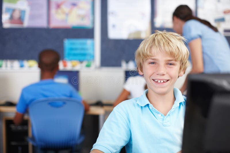 Happy in His Computer Class. Portrait of a Young Schoolboy in Computer ...