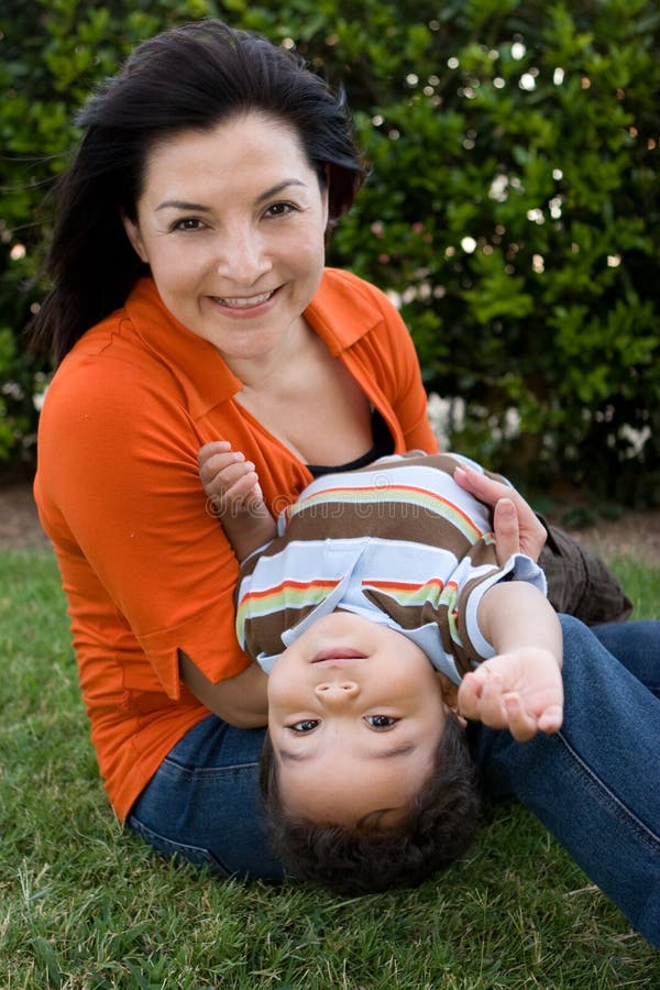 Hispanic Mother and Her Daughter. Stock Photo - Image of outdoors ...