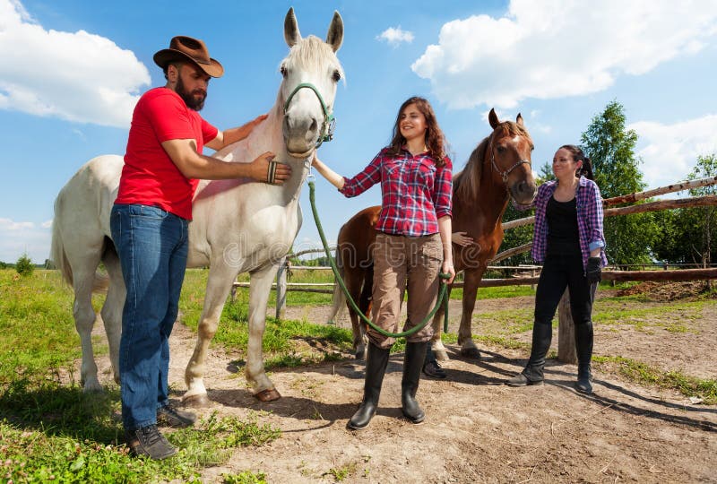 Happy Horseback Riders Having Rest at the Paddock Stock Image - Image ...