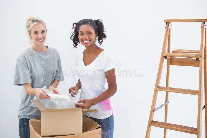 Happy Housemates Unpacking Moving Boxes Stock Image - Image of hair ...