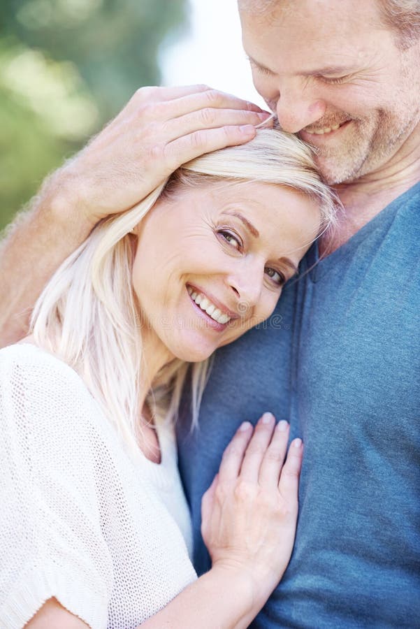 Happy Hug And Portrait Of Mature Couple In Park For Bonding
