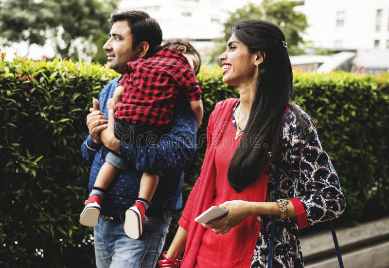 A Happy Indian Family Walking Stock Photo - Image of holding, love ...