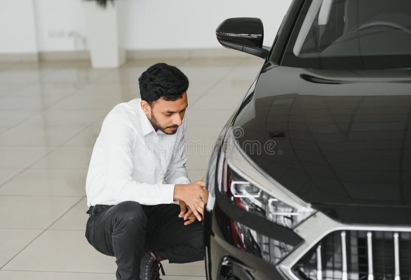 Happy Indian Man Checking Car Features at Showroom Stock Image - Image ...
