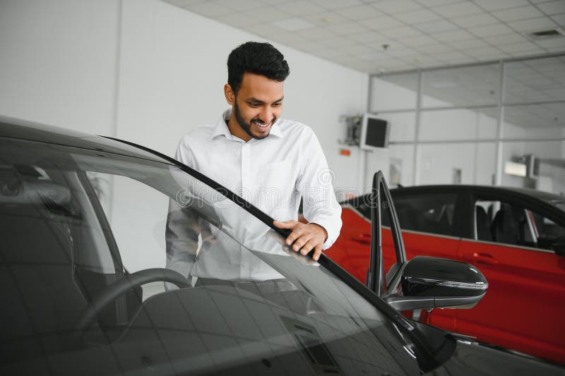 Happy Indian Man Checking Car Features at Showroom Stock Image - Image ...