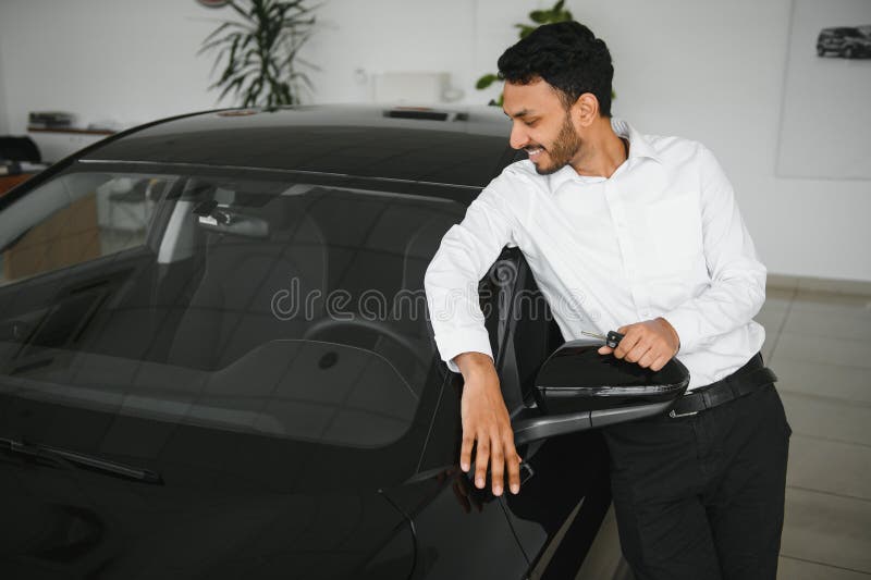 Happy Indian Man Checking Car Features at Showroom Stock Photo - Image ...