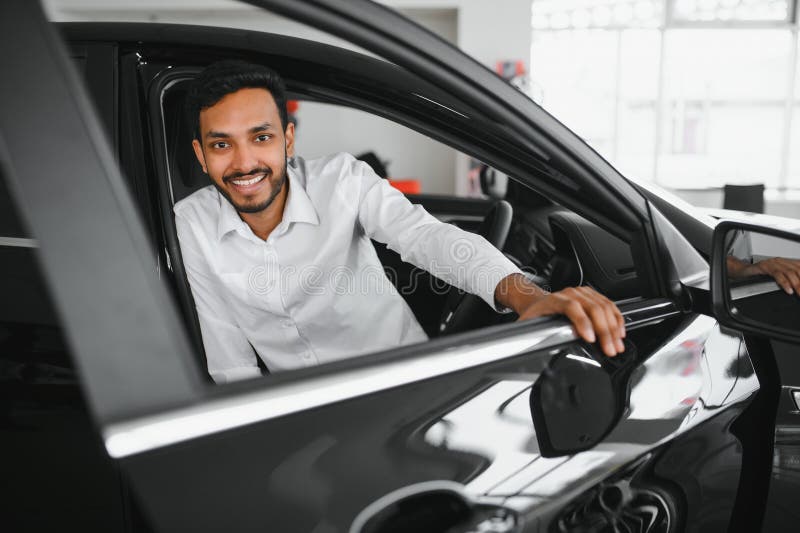 Happy Indian Man Checking Car Features at Showroom Stock Photo - Image ...