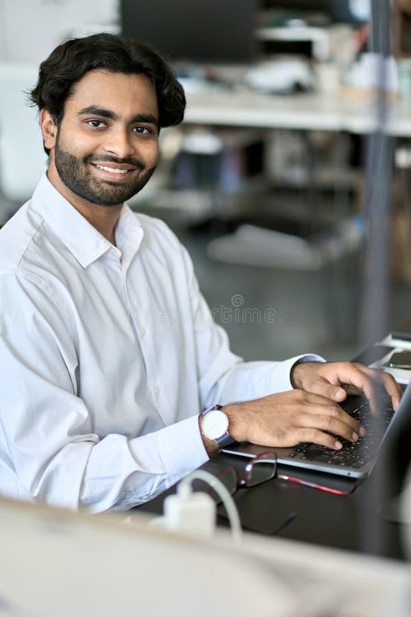 Happy Indian Young Business Man Employee Working on Laptop. Portrait ... Happy Indian Young Business Man Employee Working on Laptop. Portrait ...
