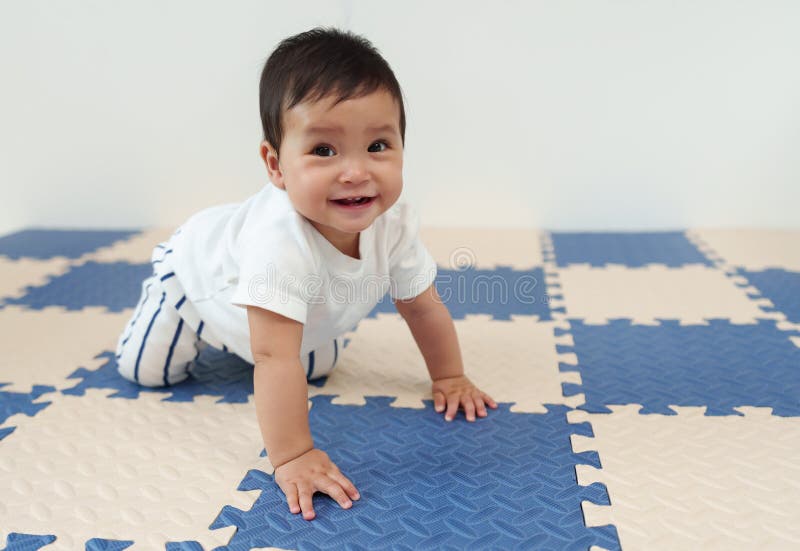 Happy Infant Baby Crawling on Mat or Jigsaw Floor Stock Photo - Image ...