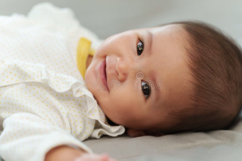 Happy Infant Baby Smilling while Lying on Bed Stock Image - Image of ...