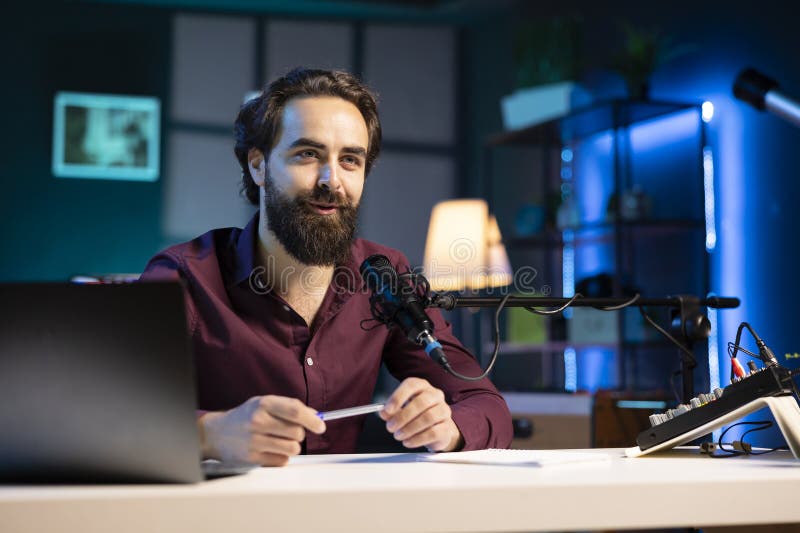 Happy Influencer Sitting at Coffee Table with Microphone and Mini House ...