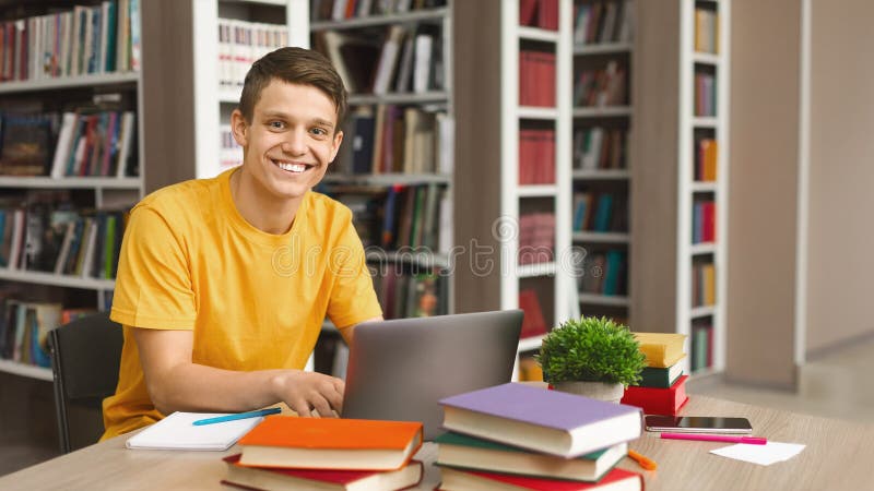 Happy Intelligent Student Getting Ready for Exams in School Library ...