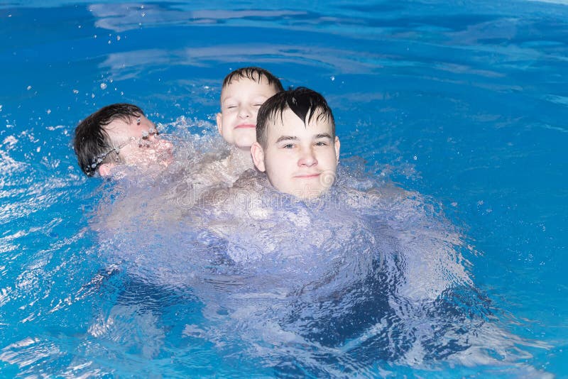 A Happy Joyful Family Swims in the Pool, Water Stock Photo - Image of ...