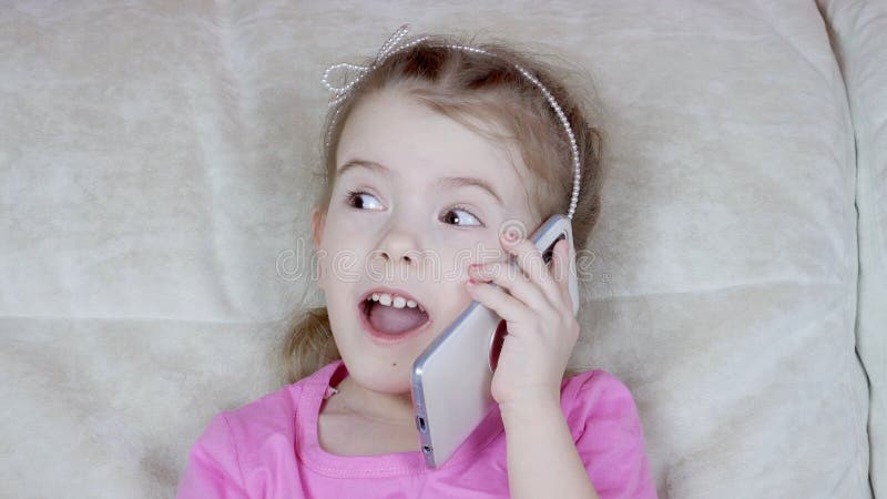 Happy Joyful Smiling Child is Speaking on the Phone Stock Image - Image ...