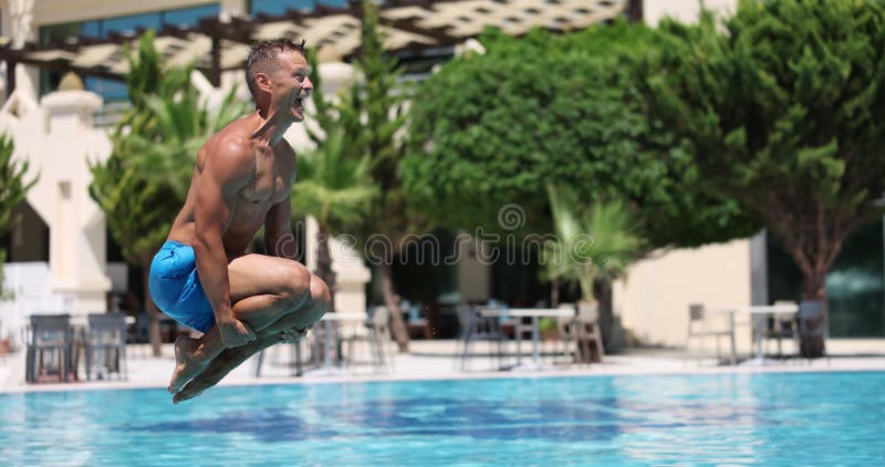 Happy Joyful Sports Man Jumping into Pool. Stock Footage - Video of ...