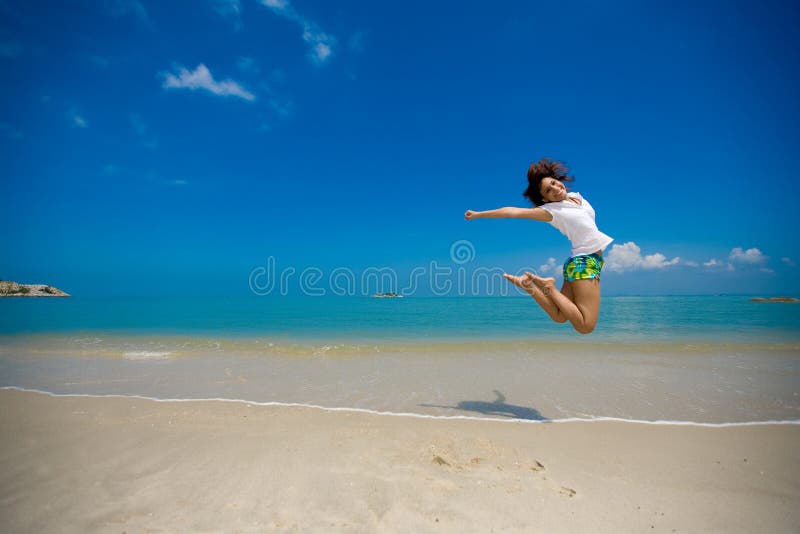 Happy jump at the beach stock image. Image of copy, female - 3695837