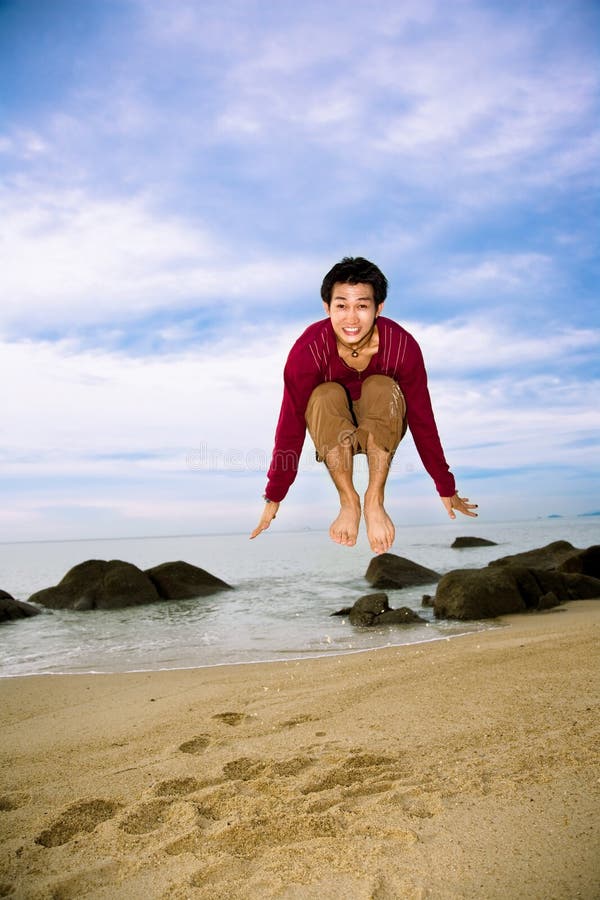 Happy jump man stock image. Image of happy, rocks, seaview - 4148053