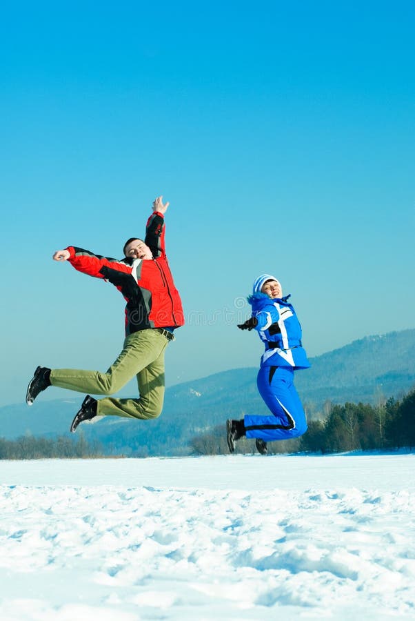 Happy jumping couple stock image. Image of blue, freedom - 8707931