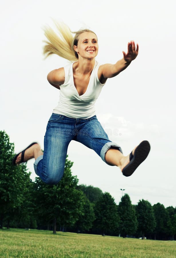 Happy jumping woman. stock photo. Image of cool, people - 5628632