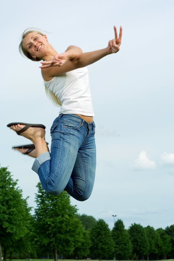 Happy jumping woman. stock photo. Image of cool, people - 5628632